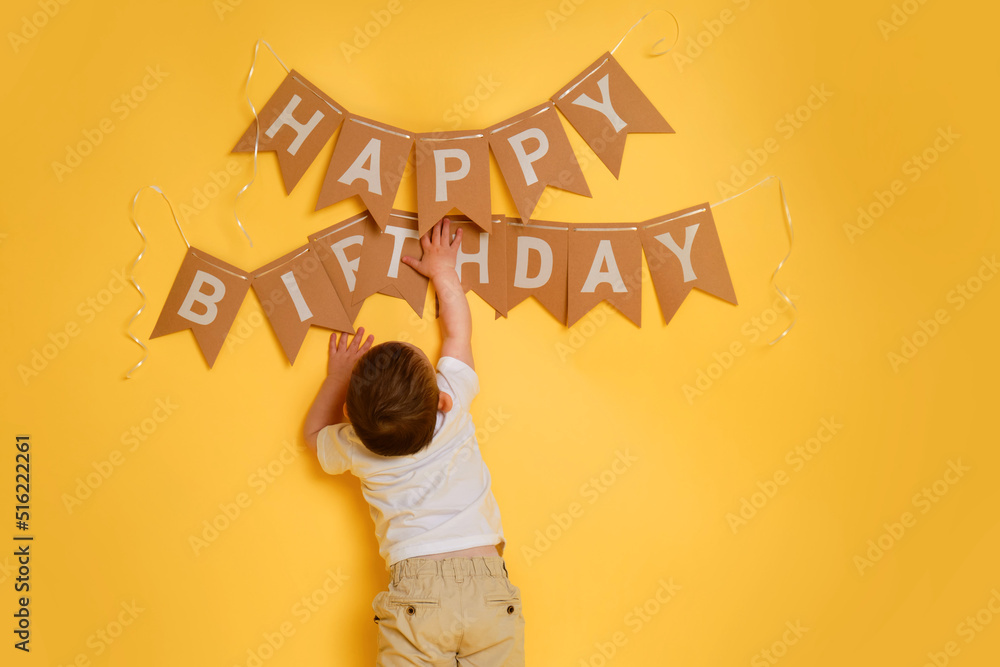 Decorations on a studio yellow background for celebrating the first ...