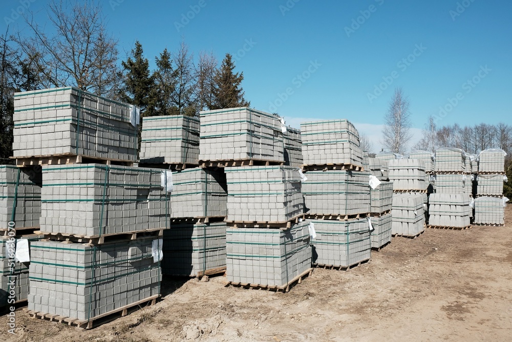 Cobblestones pallets for paving under construction laying outside ...