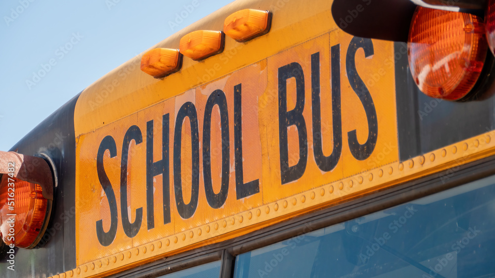 School Bus Inscription on old American school bus Stock Photo | Adobe Stock