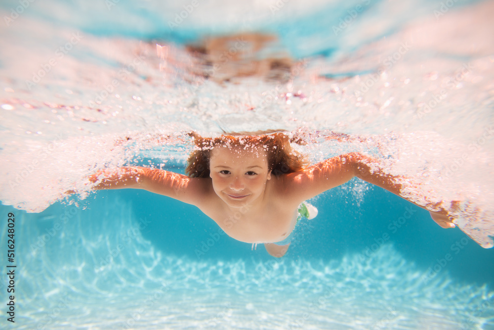 Child swim under water in sea. Kid swimming in pool underwater. Happy ...