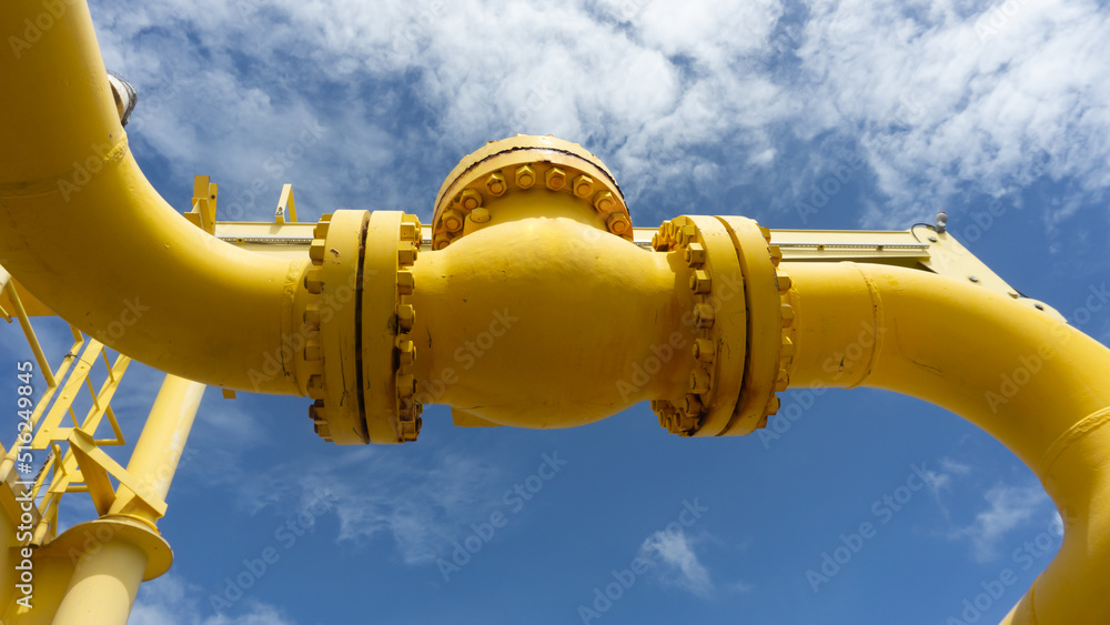Male worker inspection at steel long pipes and pipe elbow in station ...