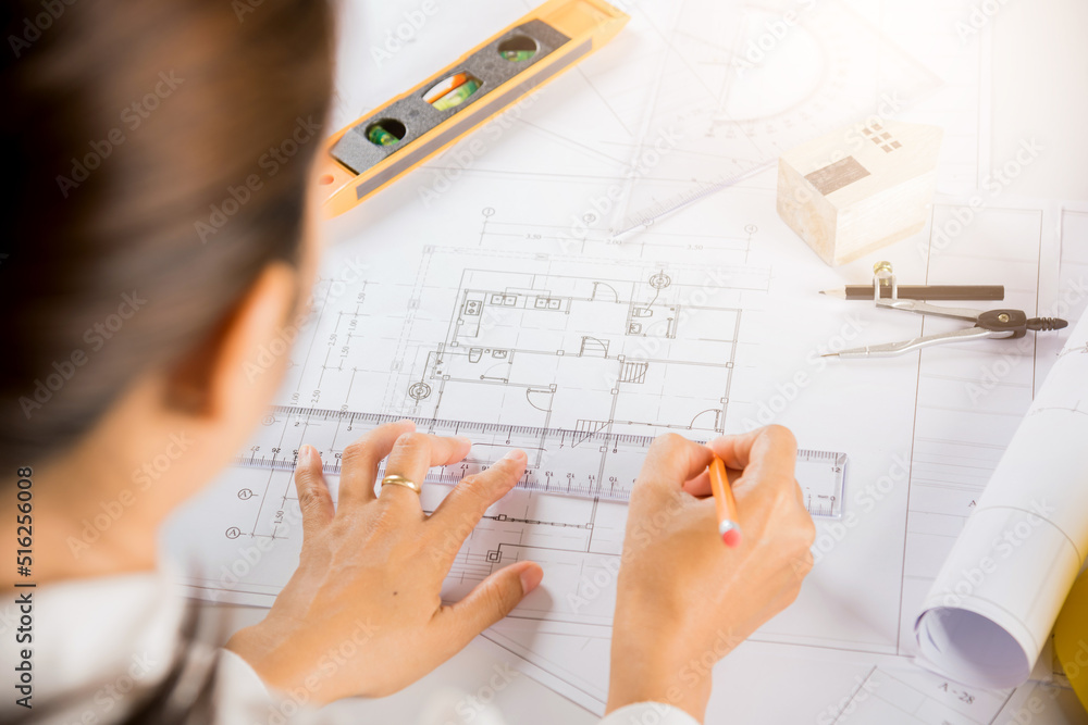 Architectural project workplace. Architect drawing with ruler on house ...