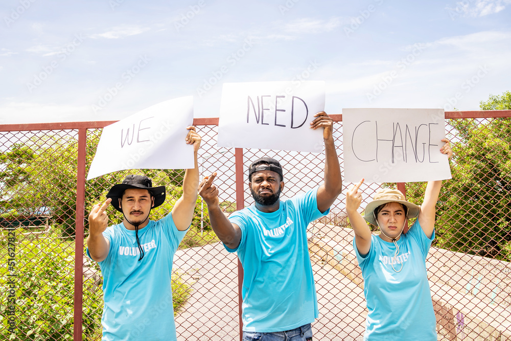 Three of people marched holding we need a change banner screaming ...