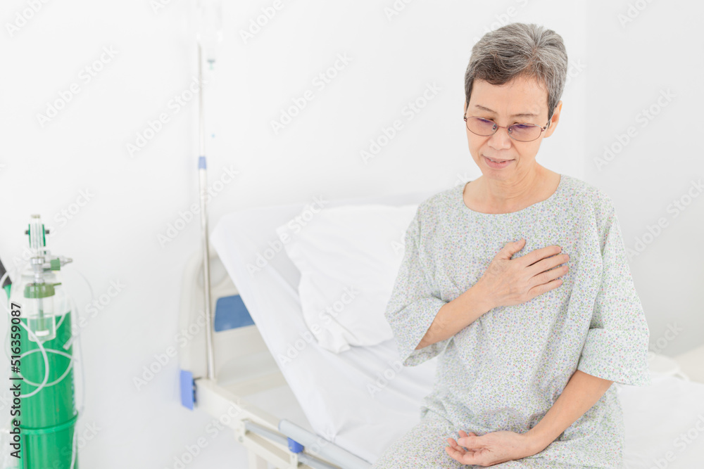 asian female patient feel tired in hospital, she use her hand touch on ...