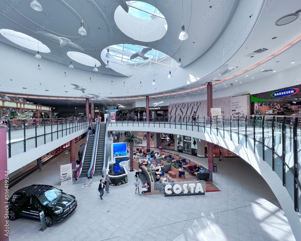 LATVIA, RIGA, JULE, 2022: Modern light multi-storey ellipsoid interior ...