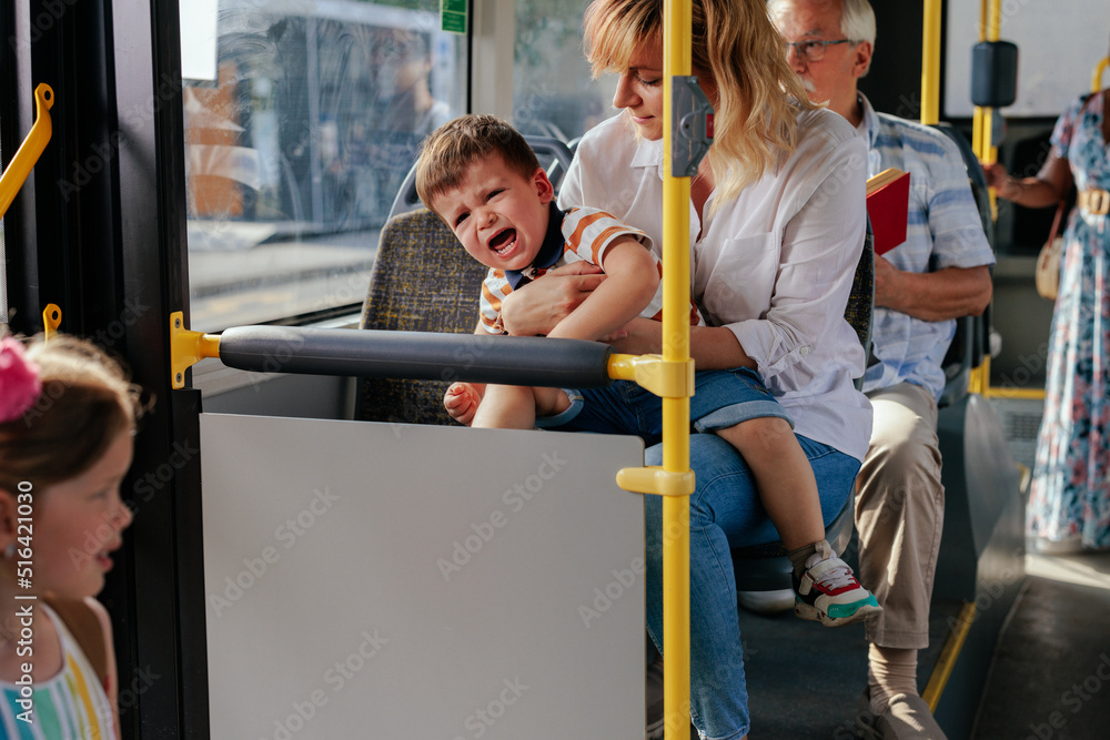 Little boy crying in the public transportation Stock Photo | Adobe Stock
