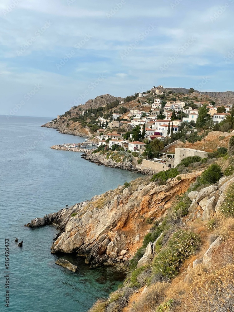Vertical aerial view of seaside buildings on the Kamini beach in Greece ...