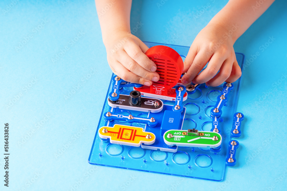 Kid's electronic constructor. Boy child development. Close up view of ...