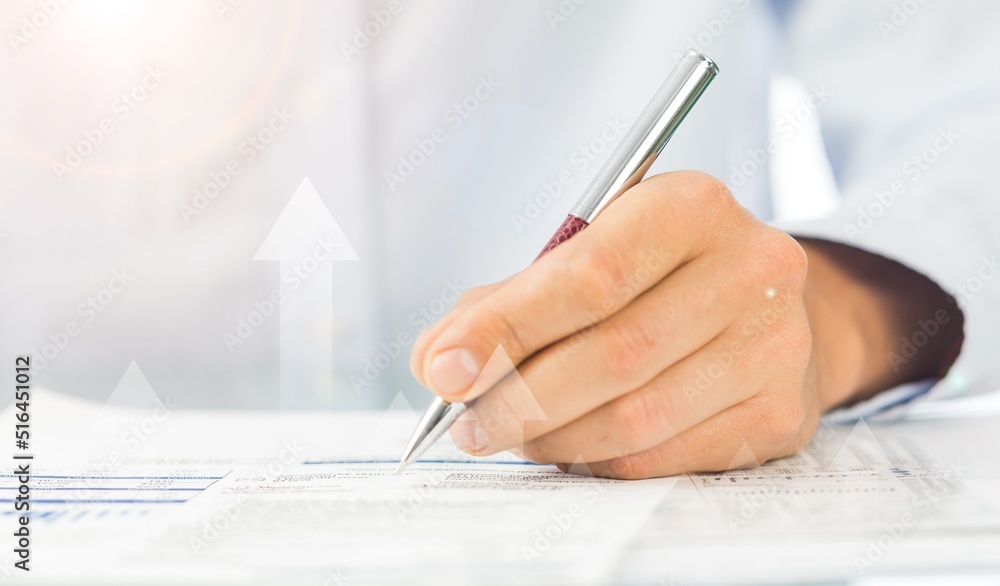 Hand using writing pen filling in business company personal information ...