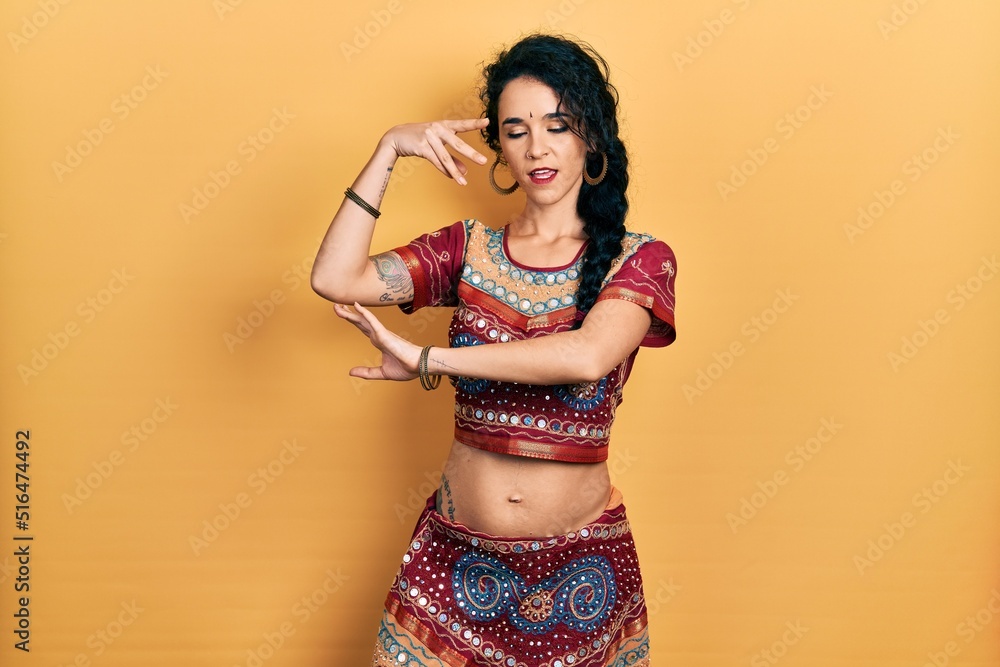 Young indian woman wearing traditional belly dancer costume. Dancing ...