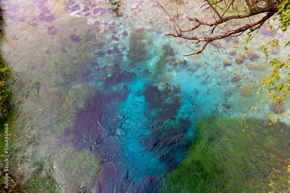 Blue Eye spring, a more than fifty metre deep natural pool with clear ...
