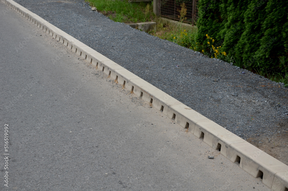 drainage hidden on the edge of an asphalt road Drainage system hidden ...