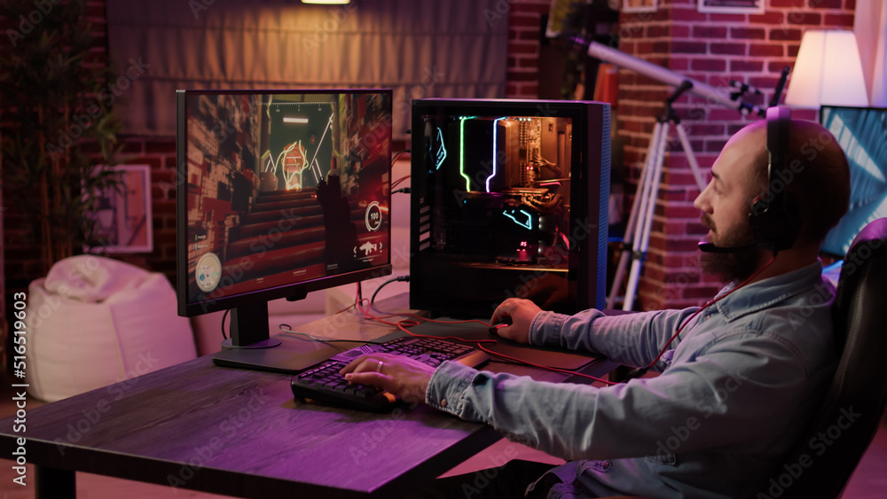 Caucasian man enjoying video game playing action first person shooter ...