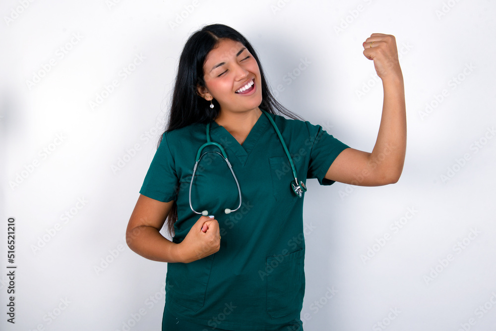 Profile photo of excited Doctor hispanic woman wearing surgeon uniform ...