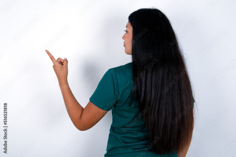 Doctor hispanic woman wearing surgeon uniform over white background ...