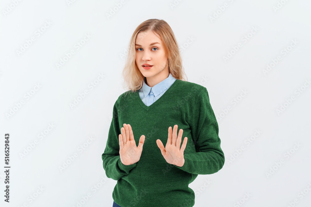 No thank you. Young woman politely rejects offer, shows block, stop ...