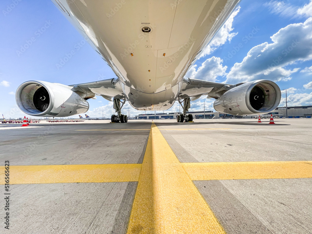 Photo & Art Print standing below -fuselage - a wide body airplane and ...