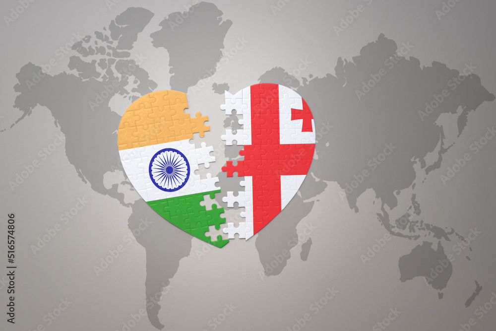 puzzle heart with the national flag of india and georgia on a world map ...