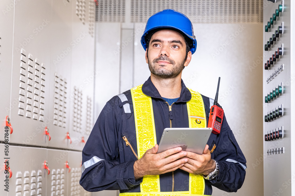 Foto de Maintenance engineer inspect relay protection system with ...