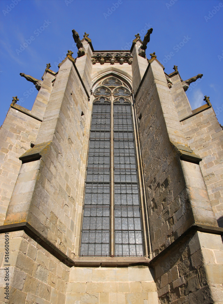 Pointed window with gothic tracery and buttress construction at the ...