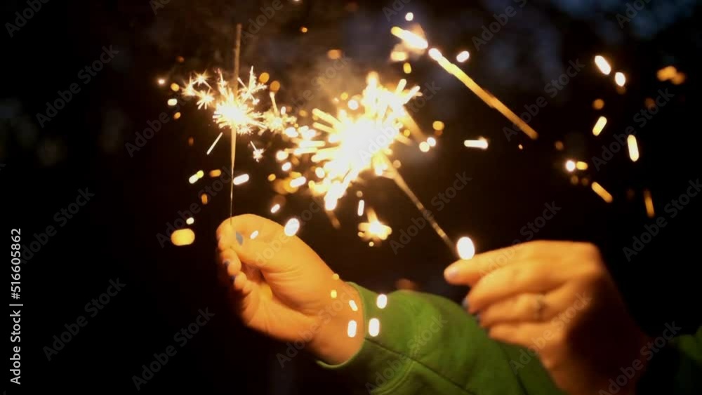 Lit sparklers on the 4th of July. Stock Video | Adobe Stock