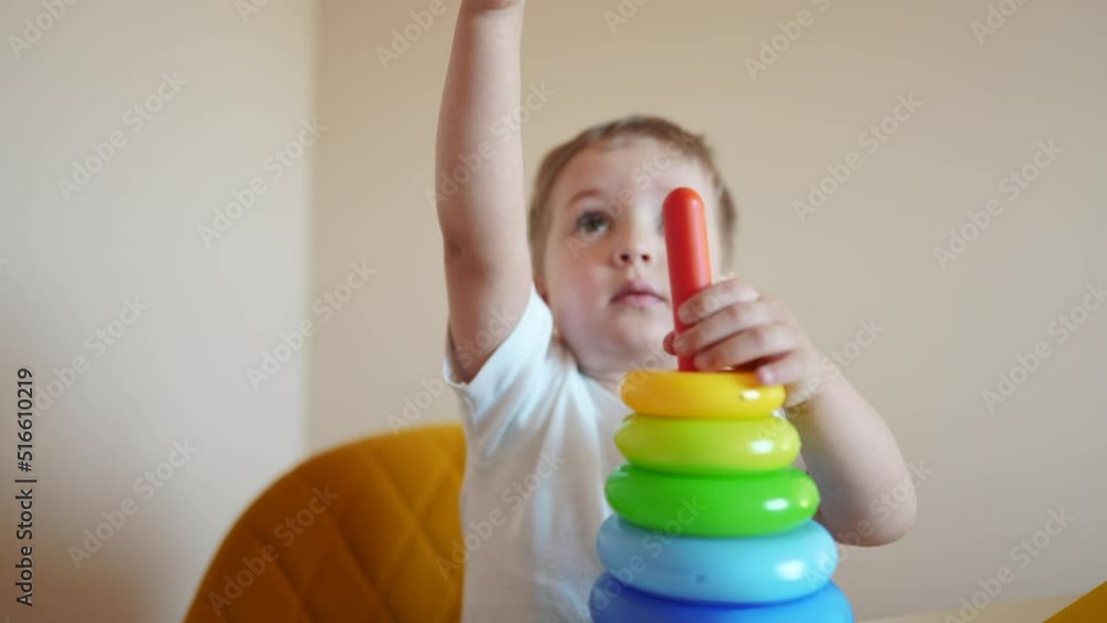 kid playing pyramid toy. happy family kindergarten kid dream concept ...