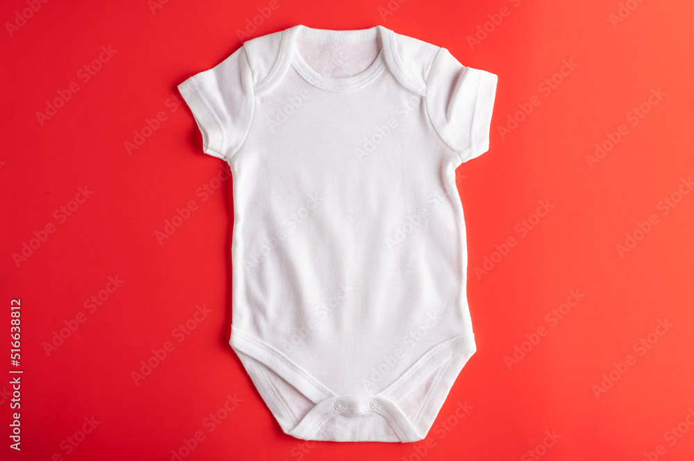 Flat lay mockup of a white baby bodysuit on a red background, for girls ...