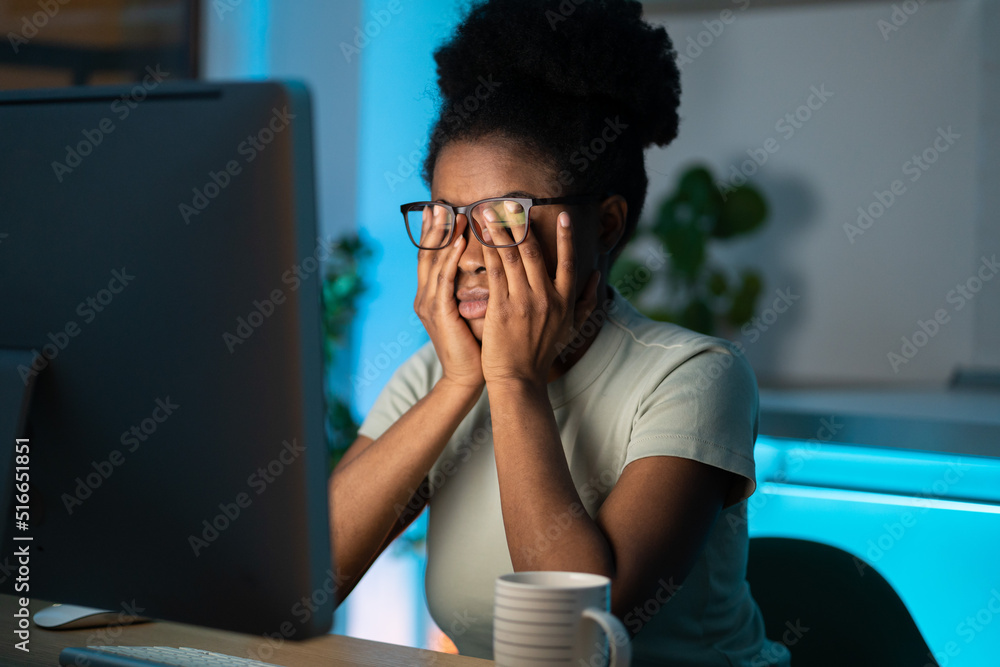 Symptoms of overworking. Young tired overworked african woman ...
