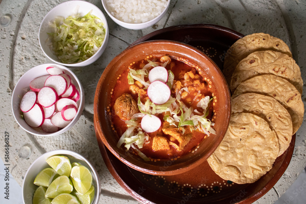 Pozole rojo preparado con tostadas e ingredientes Stock Photo | Adobe Stock