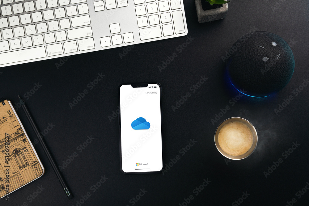 Microsoft Onedrive app on the smartphone screen on black background ...