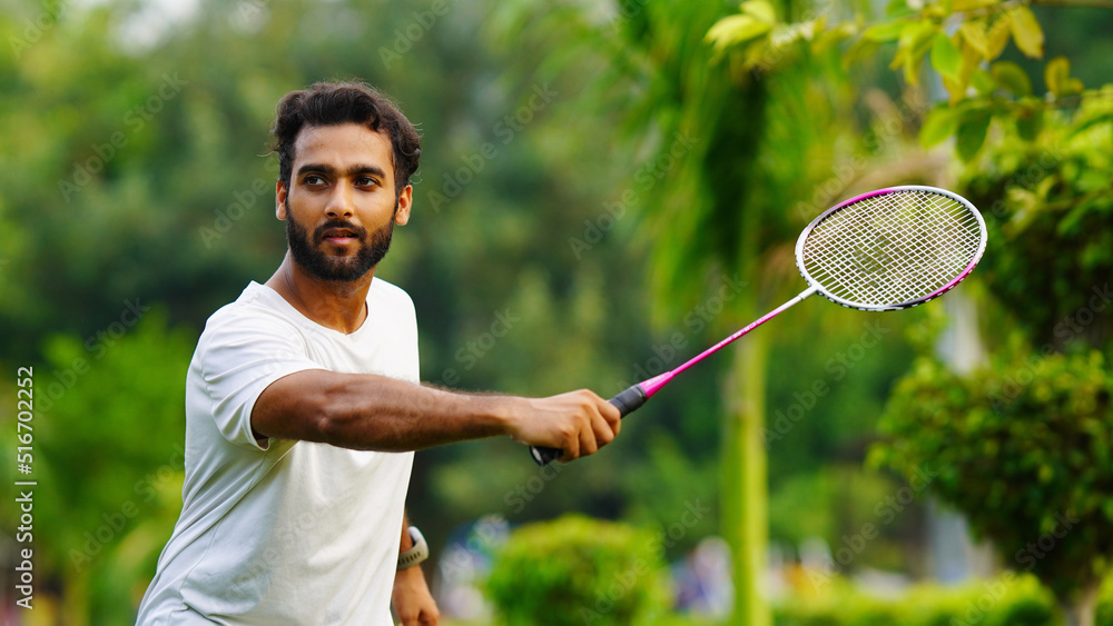 badminton player in happy mood and laughing in park Stock Photo | Adobe ...