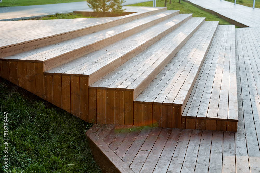 Steps made of boards, a wooden staircase, a descent from the top, solar ...