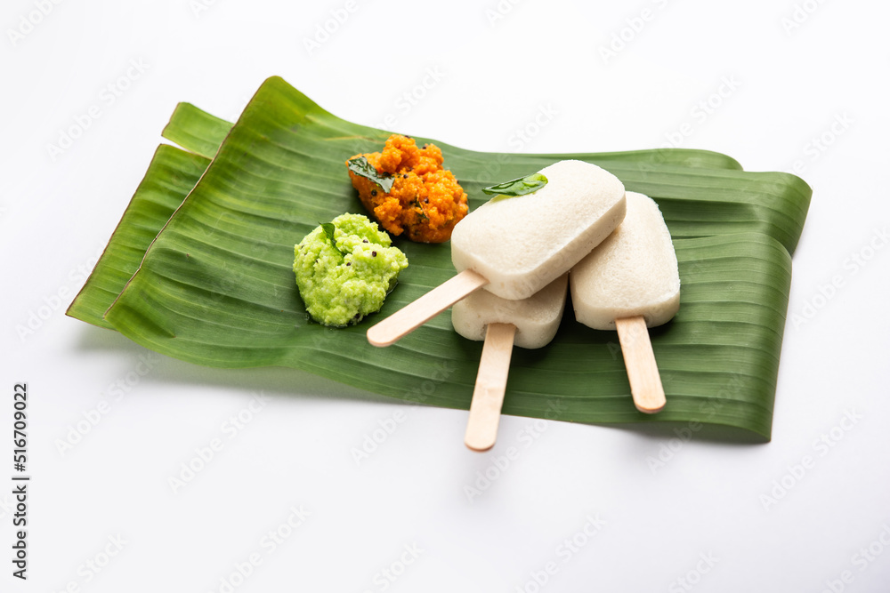Idly lollipop or idli candy with stick served with sambar and chutney ...