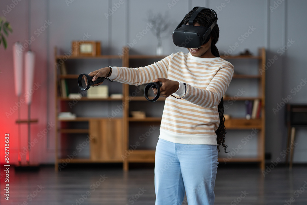 Excite black woman testing virtual reality device in digital world ...