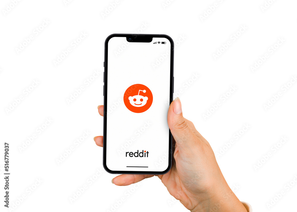 Female hand holding a smartphone iPhone with Reddit social media app ...