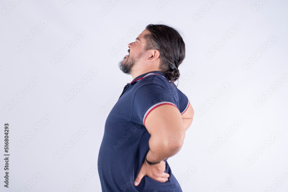 A man feeling lower back pain in the lumbar region. Suffering from a ...