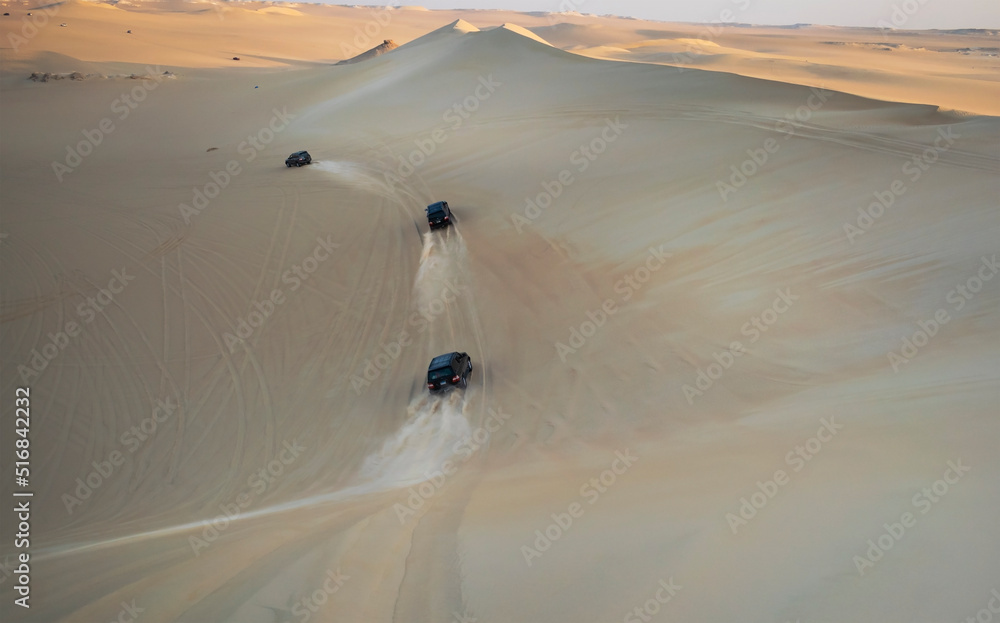 sand dunes and cars in the desert Stock Photo | Adobe Stock