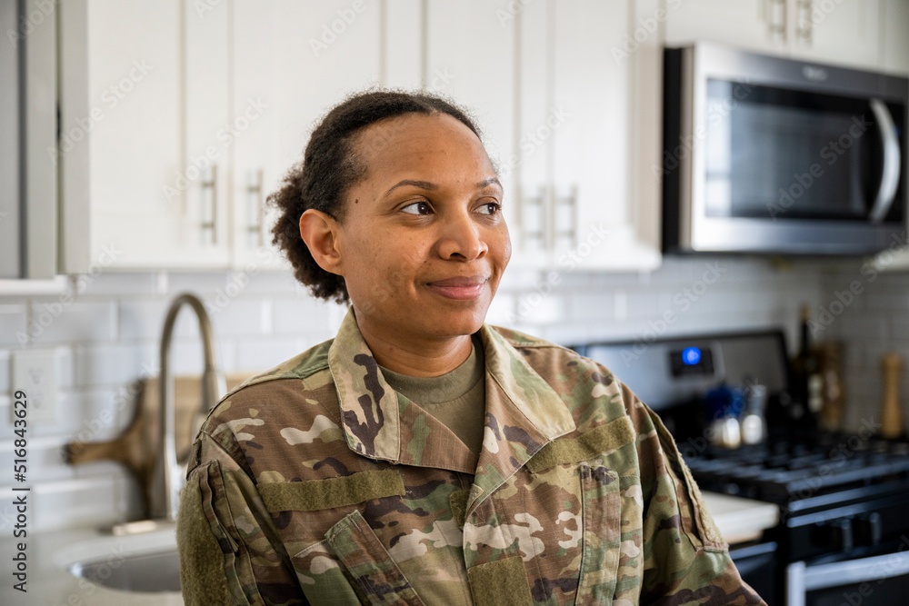 U.S. Army female soldier in her kitchen Stock Photo | Adobe Stock