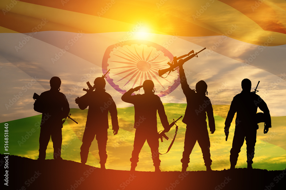 Silhouettes of soldiers on a background of India flag and the sunset or ...