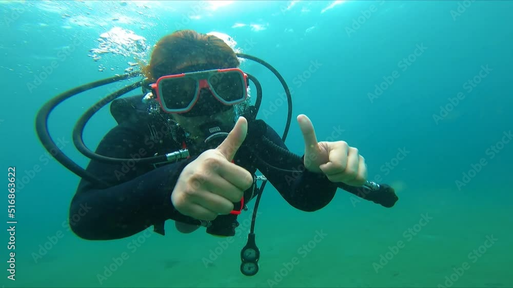 Woman Enjoying Scuba Diving Waving at the Camera Underwater FHD Stock ...