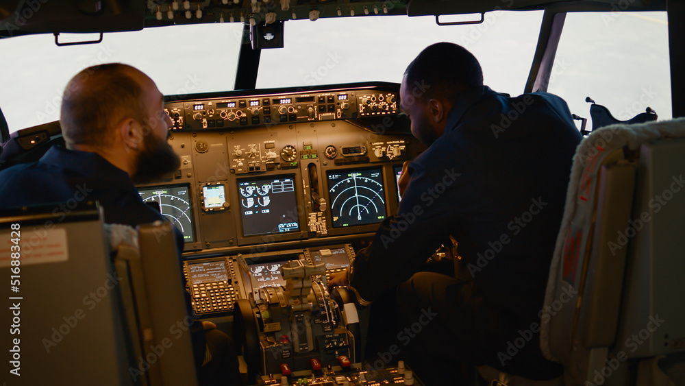 Diverse Team Of Captain And Copilot Preparing To Takeoff With Airplane Inserting Destination