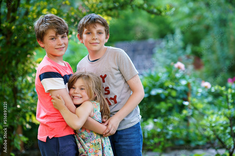 Portrait of three siblings children. Two kids brothers boys and little ...