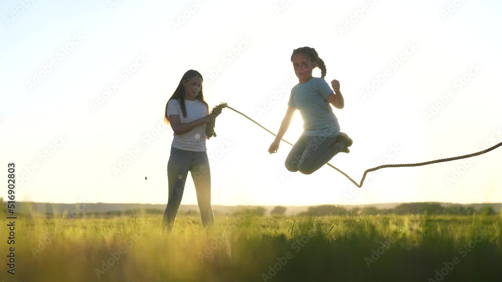 children in the park playing rope jumping. happy family kid dream ...
