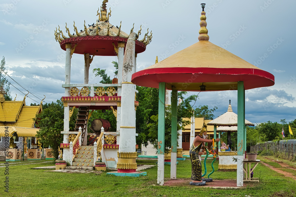 Various shrines and a drum tower in a buddhist village temple complex ...