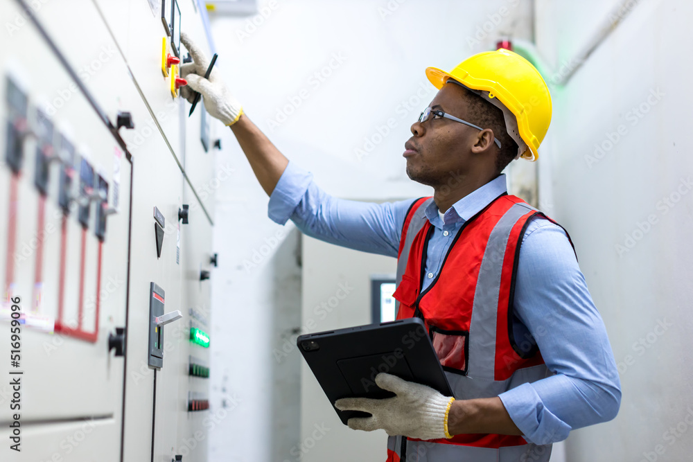 Electrical engineer working in control room. Electrical engineer man ...