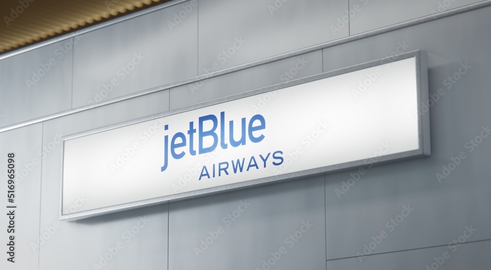 JetBlue Airways logo on illuminated airport sign. Editorial 3D ...