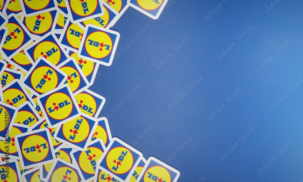 Lidl supermarket chain logo on paper cards layed out in a heap on flat ...