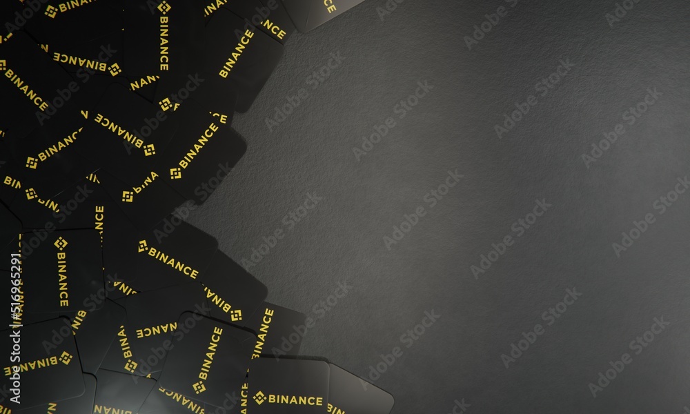 Binance logo on paper cards layed out in a heap on flat surface Stock ...