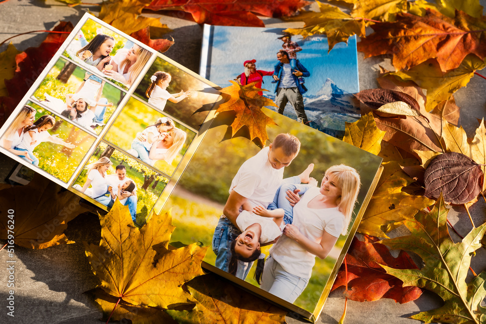 Autumn yellow leaves and family photobook. fall leaves arranged for a ...