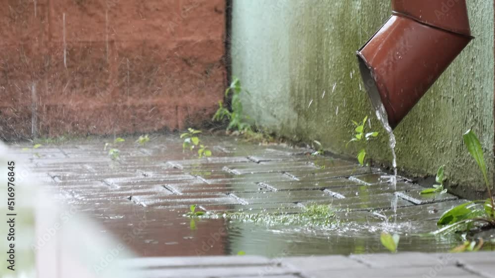 bad weather in the summer it rains water flows into the gutter Stock ...